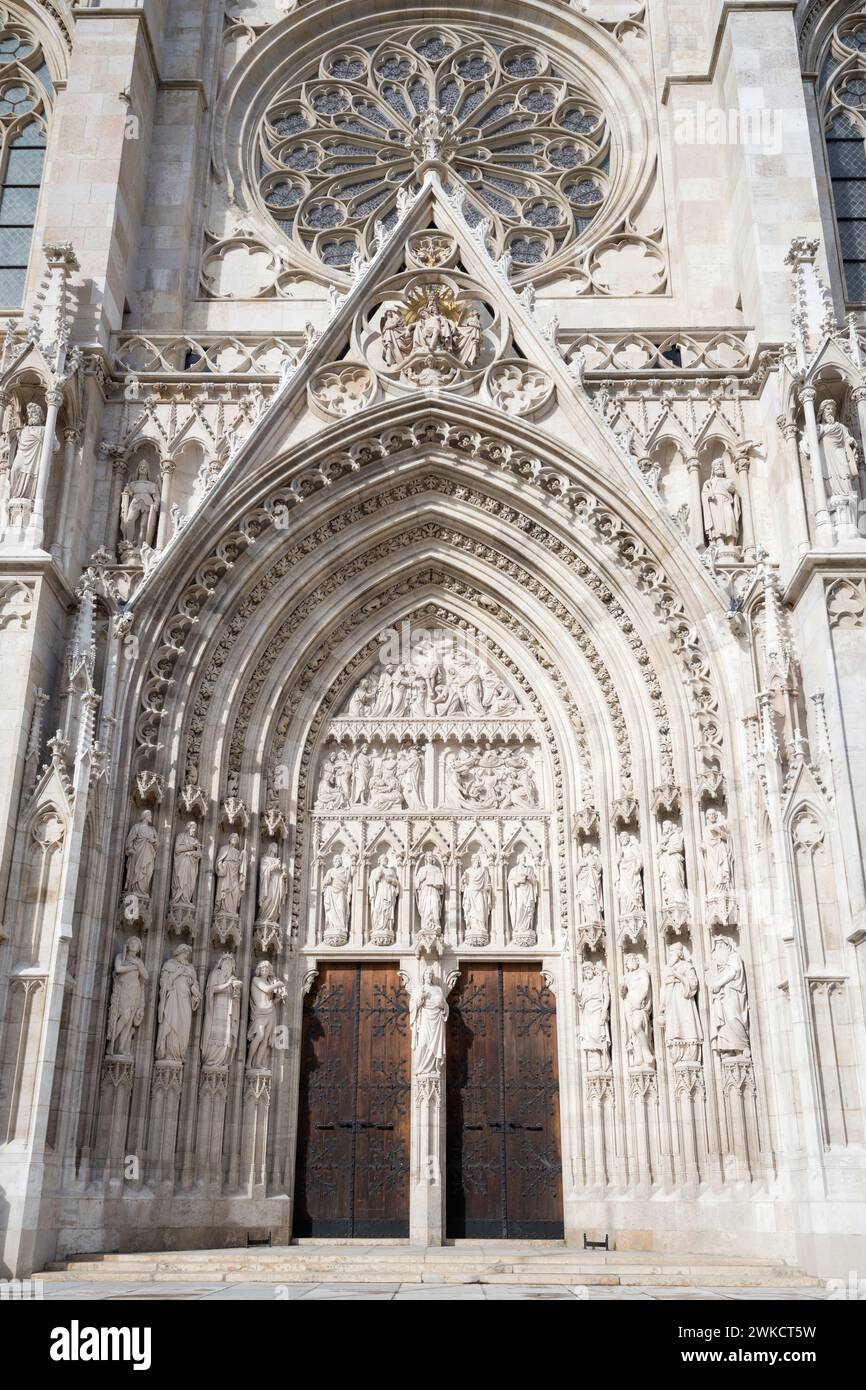 Statues, decorations and reliefs above the door to the Votive Church ...