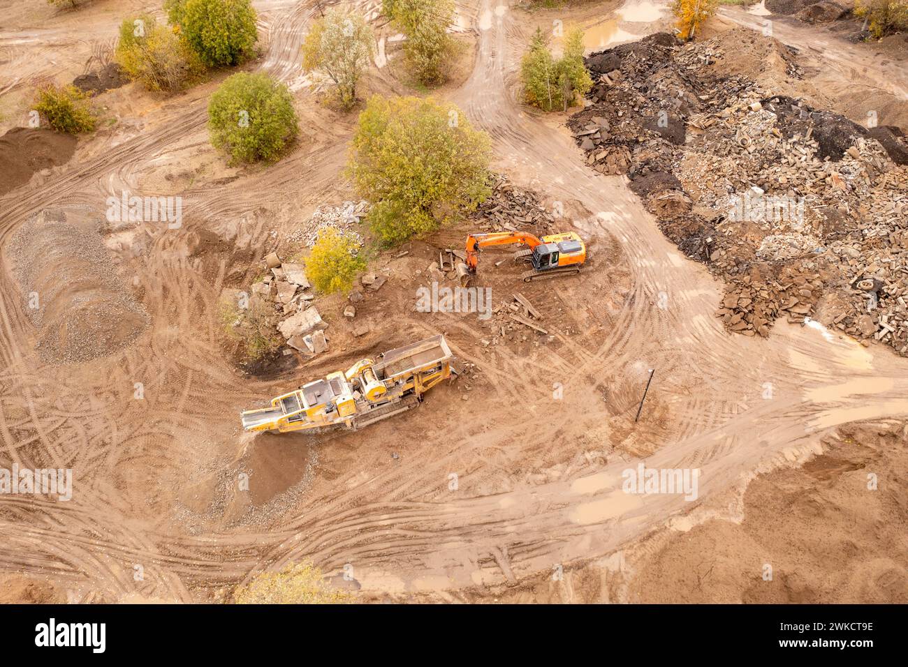 Drone photography of construction waste dumping site and machinery ...