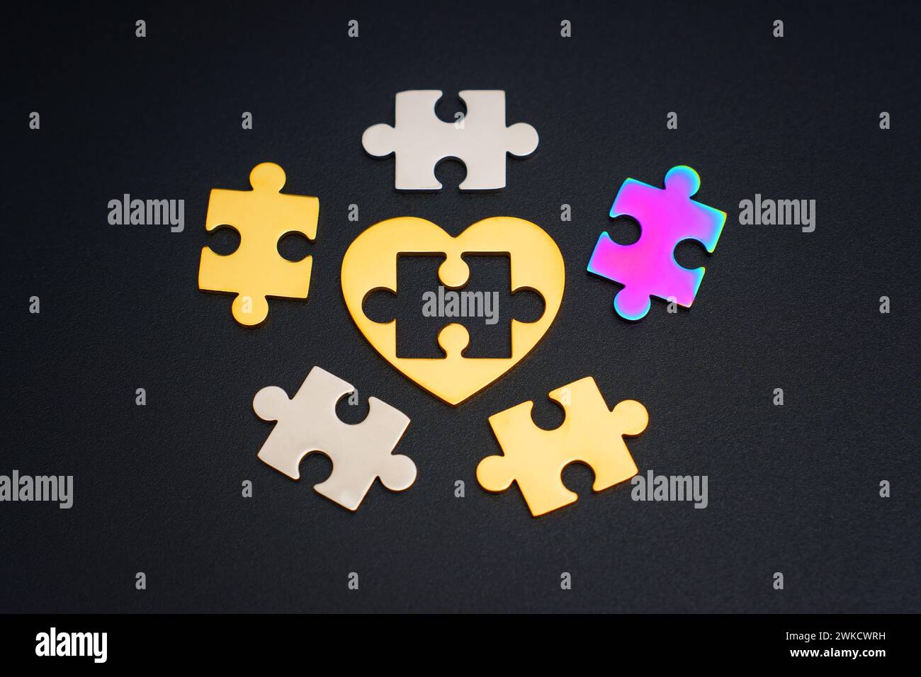 Gold heart and five puzzle pieces, each matching in shape but ...