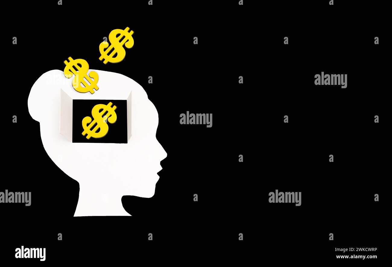 Close-up of a paper female head profile isolated on black background ...