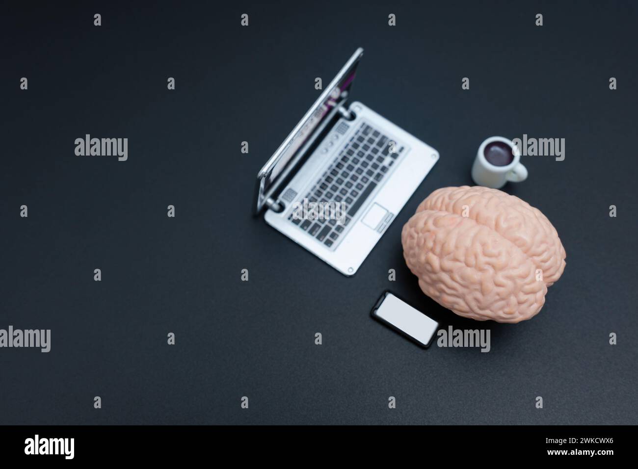 Brain engaged in work, equipped with a phone and coffee, diligently ...