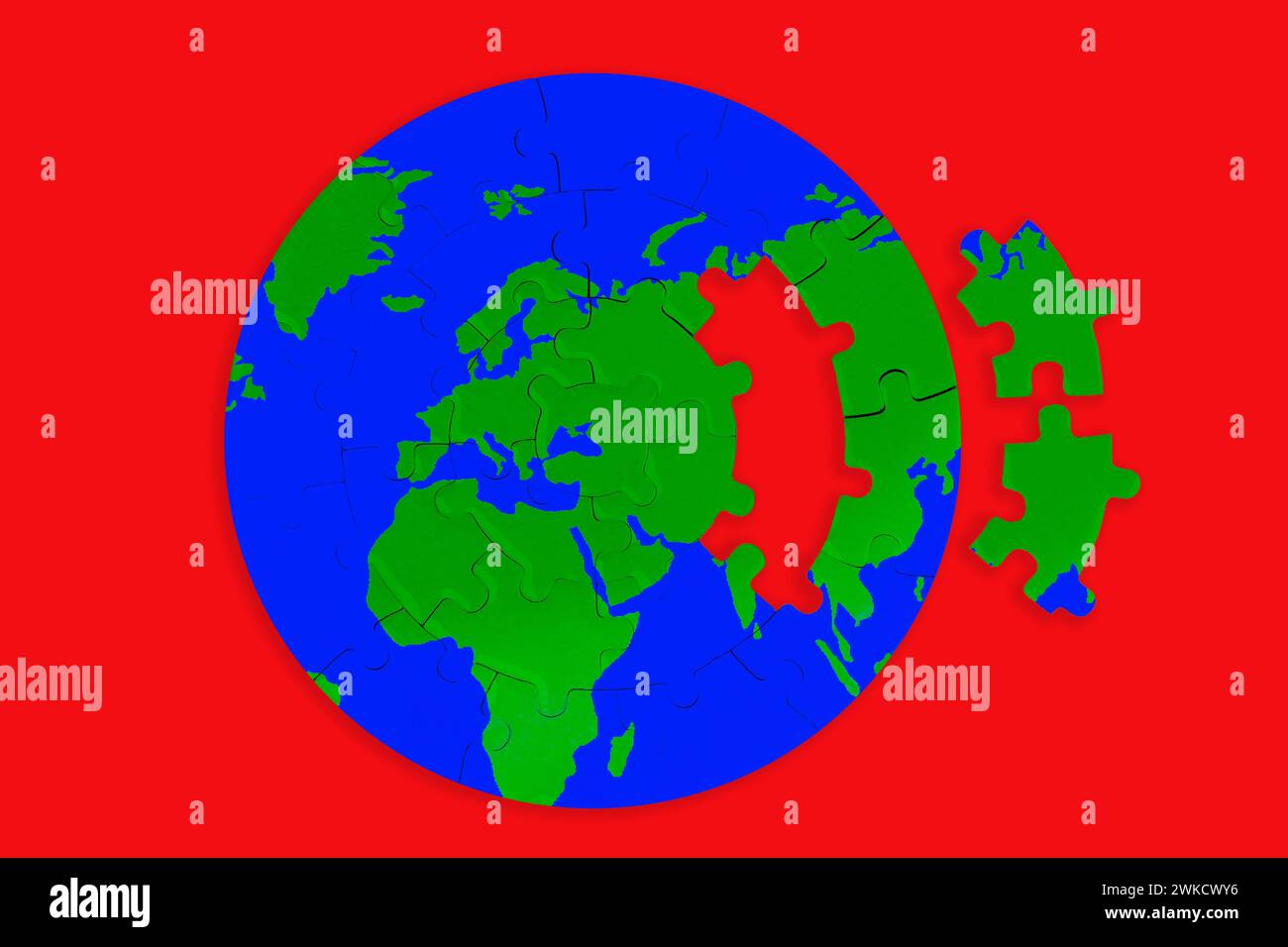 Round puzzle in the shape of a globe, featuring vibrant green ...