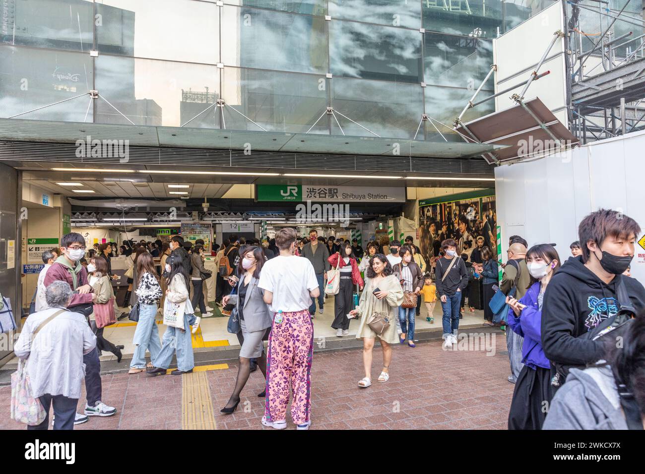 Shibuya rail station in Tokyo, commuters crowds outside the entrance ...