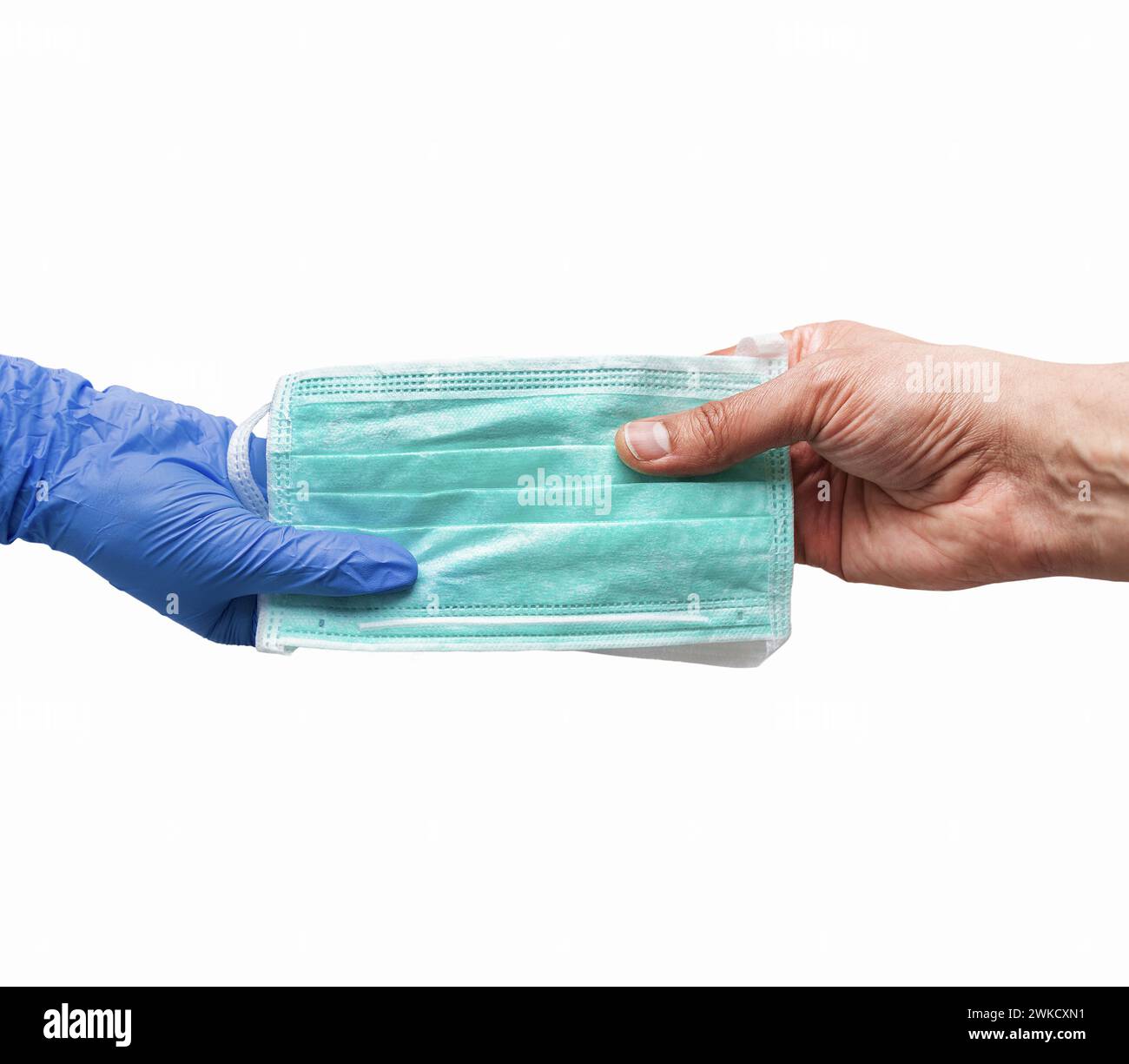 Doctor giving a mask to a patient for protection against viruses and ...