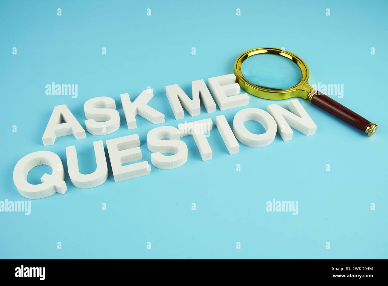 Ask me question alphabet letters with magnifying glass on blue ...