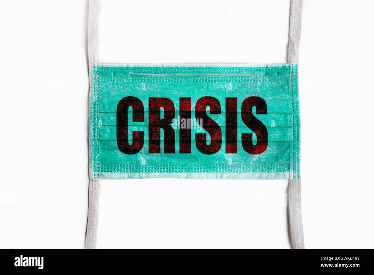 Medical mask with the words CRISIS. Crisis protection concept Stock ...