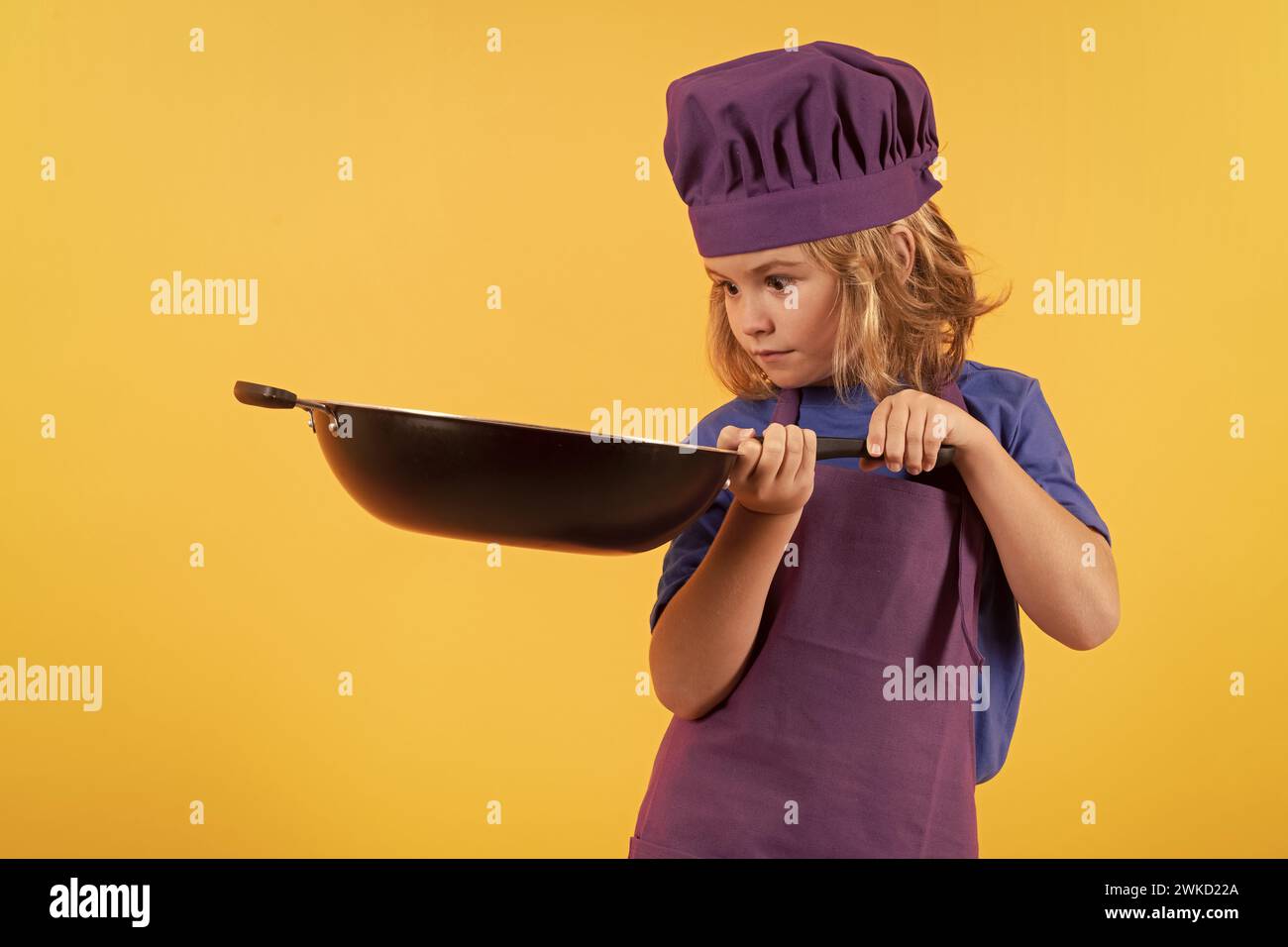 Kid cook with cooking pan. Child cooking, little chef prepares food ...