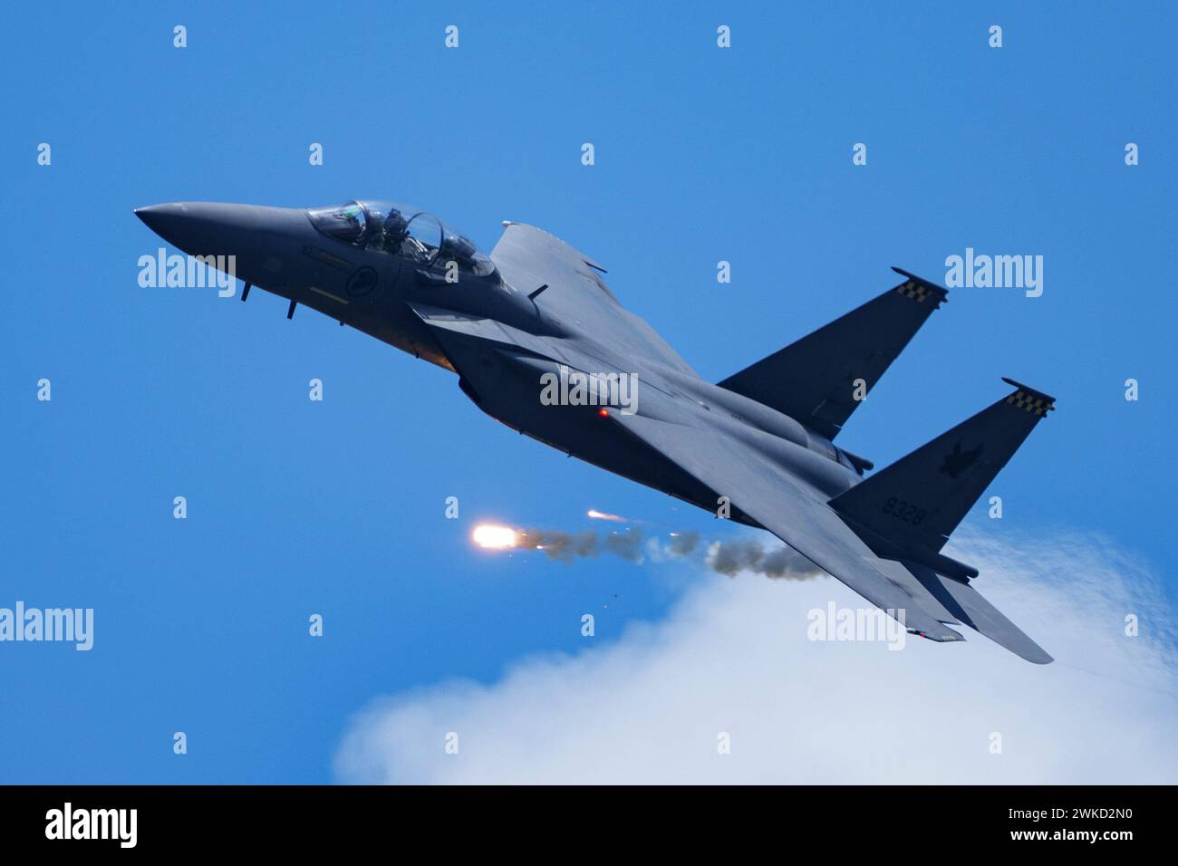 A Singaporean Air Force's F15SG fighter jet releases flares during an ...