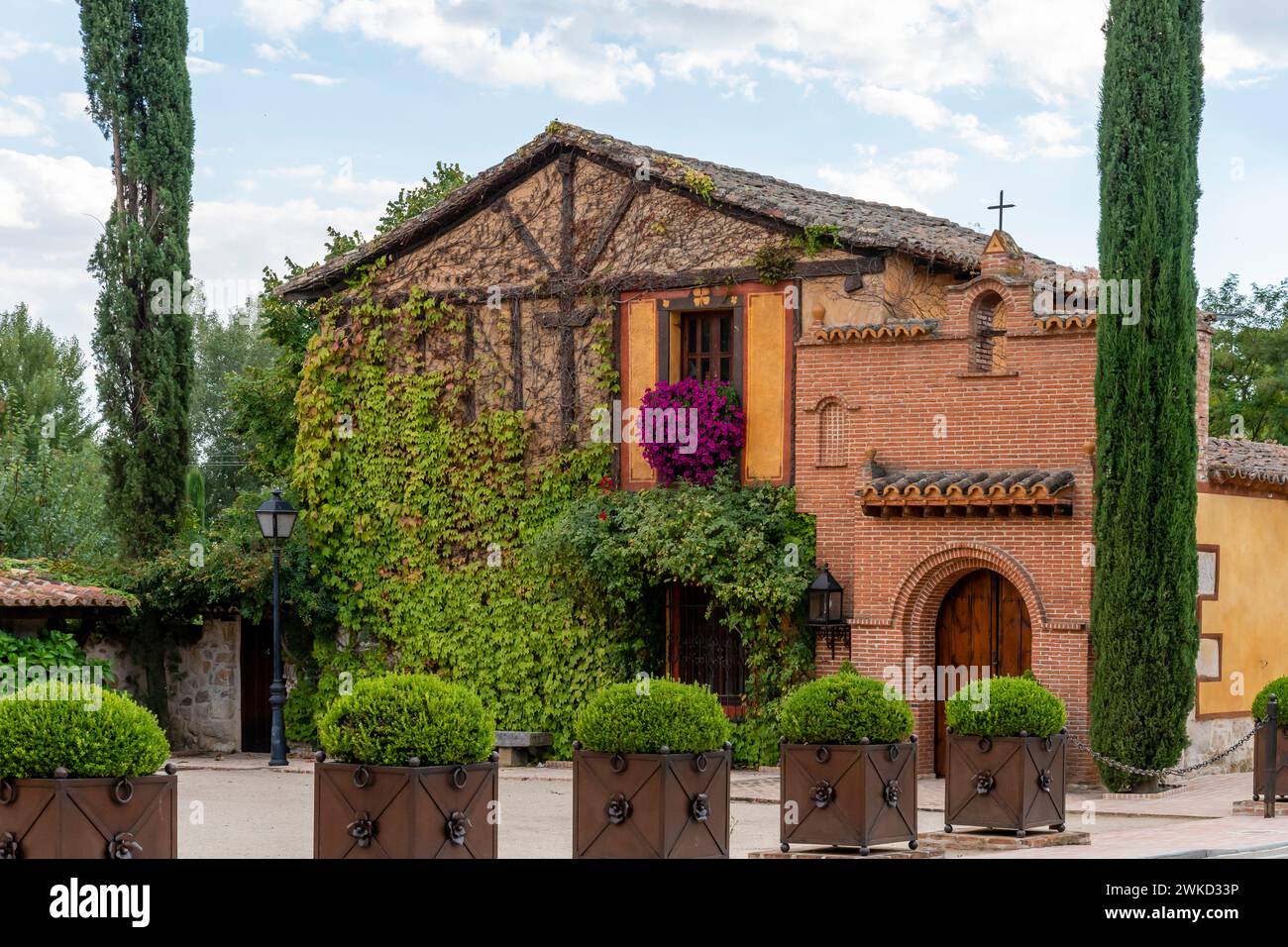 Facade of a farmhouse with vines Stock Photo - Alamy