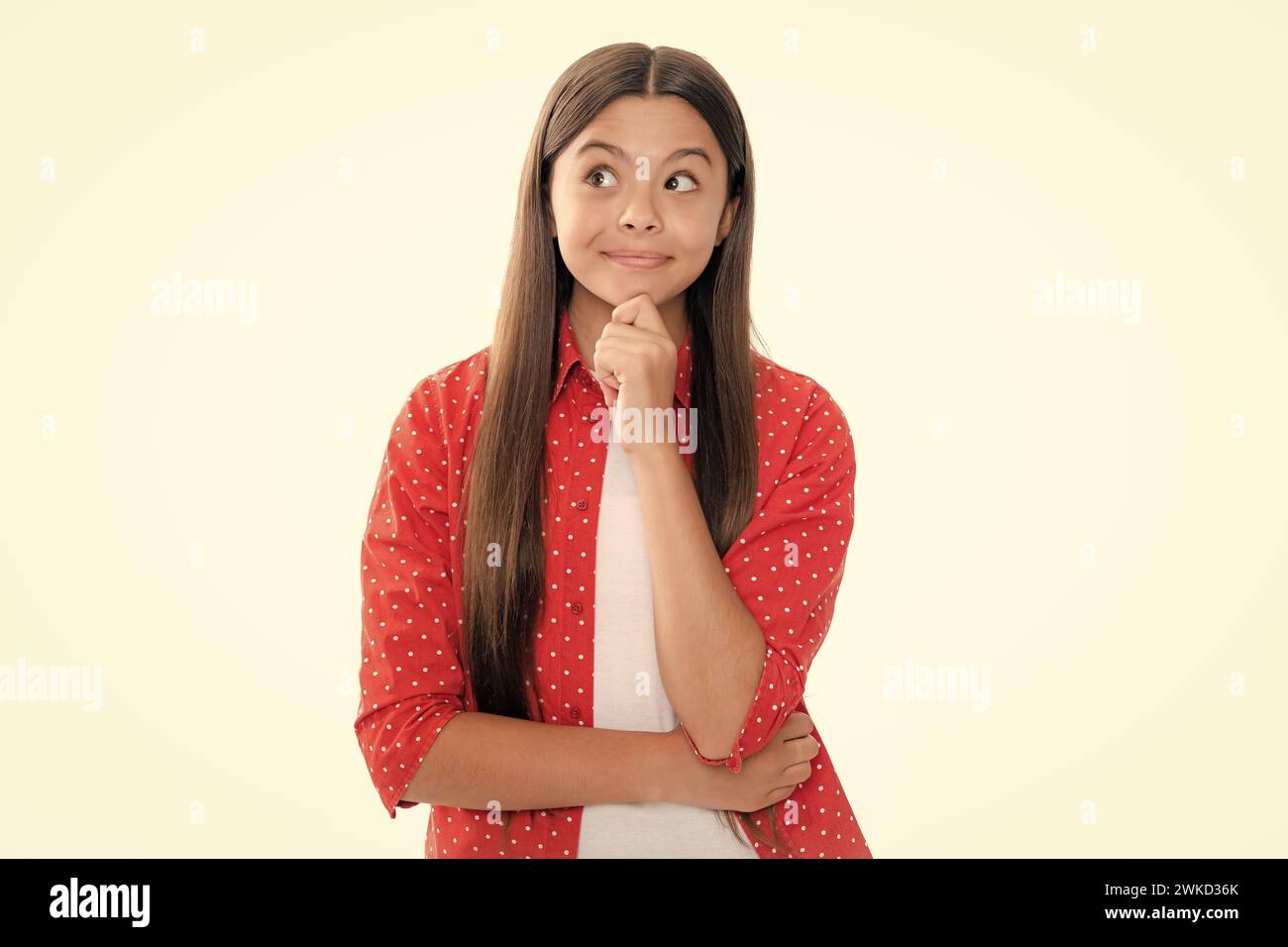 Thoughtful teenage child girl on white isolated background. Portrait of ...