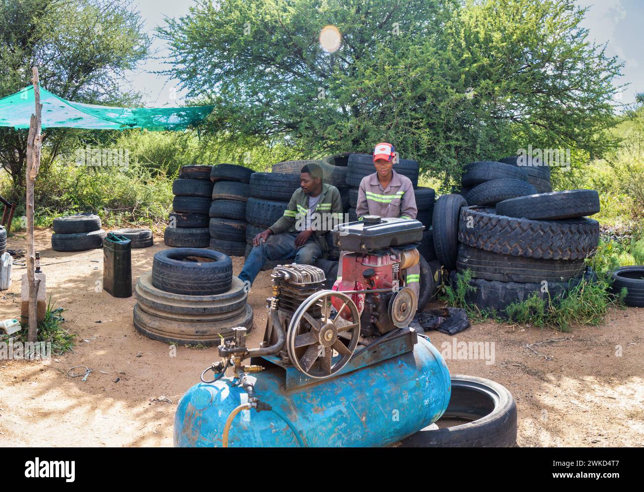 millennial african american workers ,working on the side of the road ...