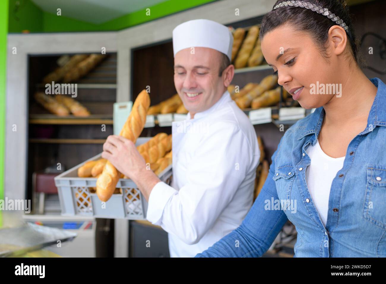 baker and clerk working in bakery Stock Photo - Alamy