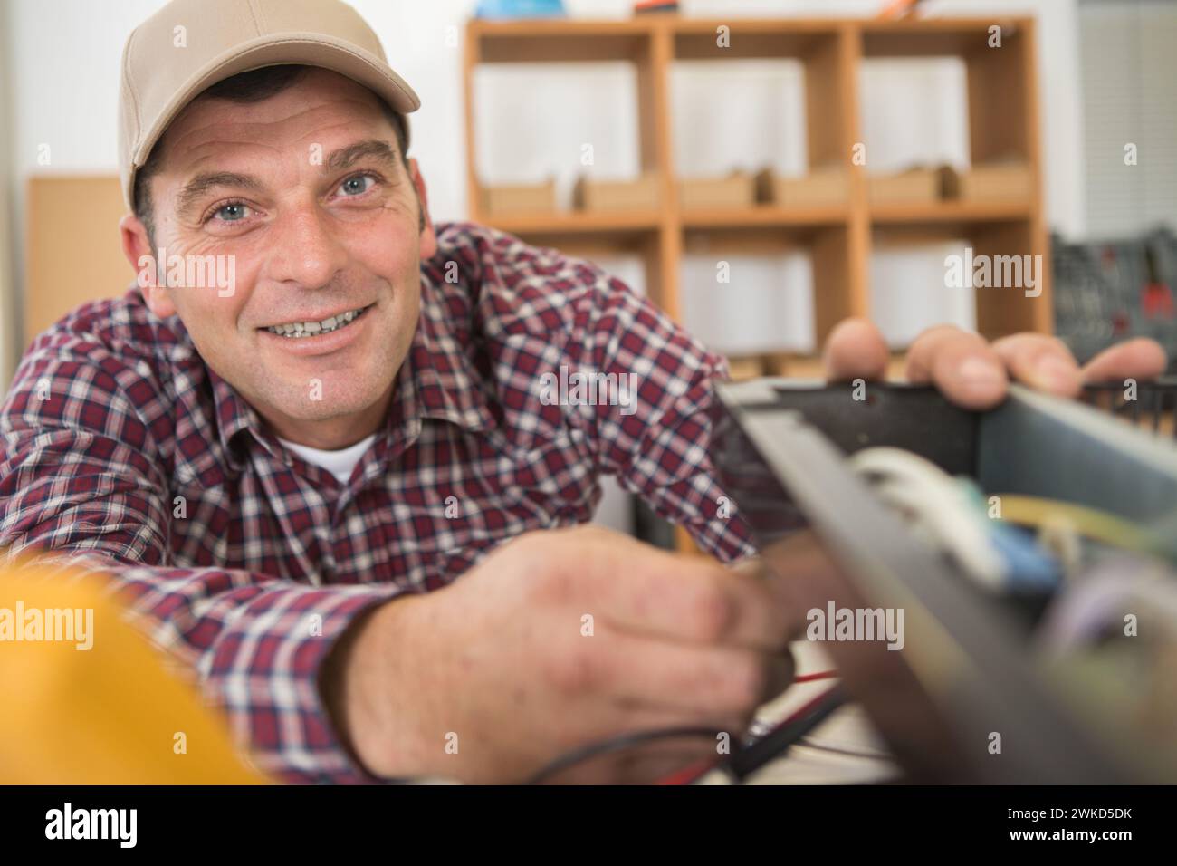 happy man is a fixing device Stock Photo - Alamy