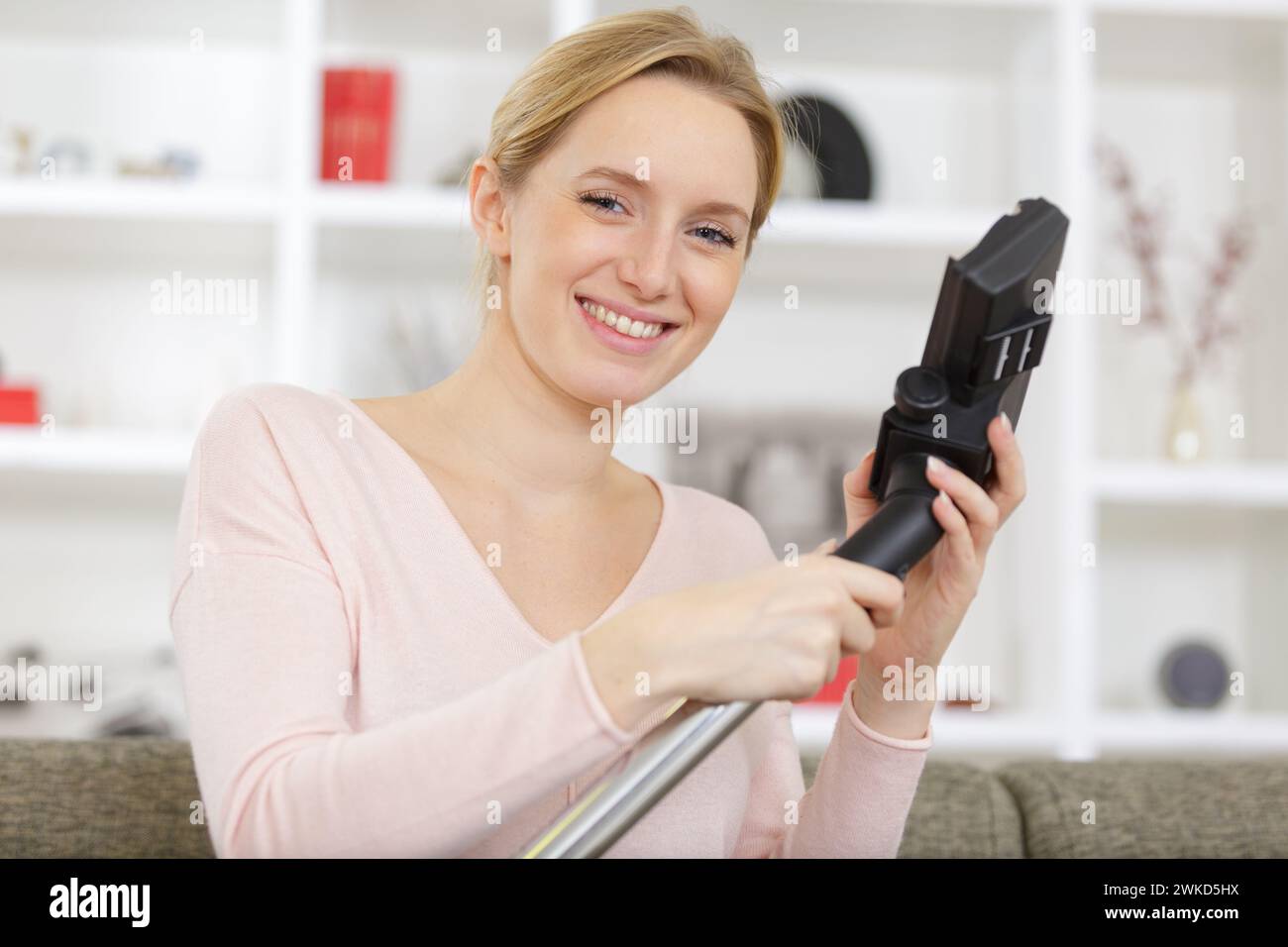 Beautiful young janitor holding hi-res stock photography and images - Alamy