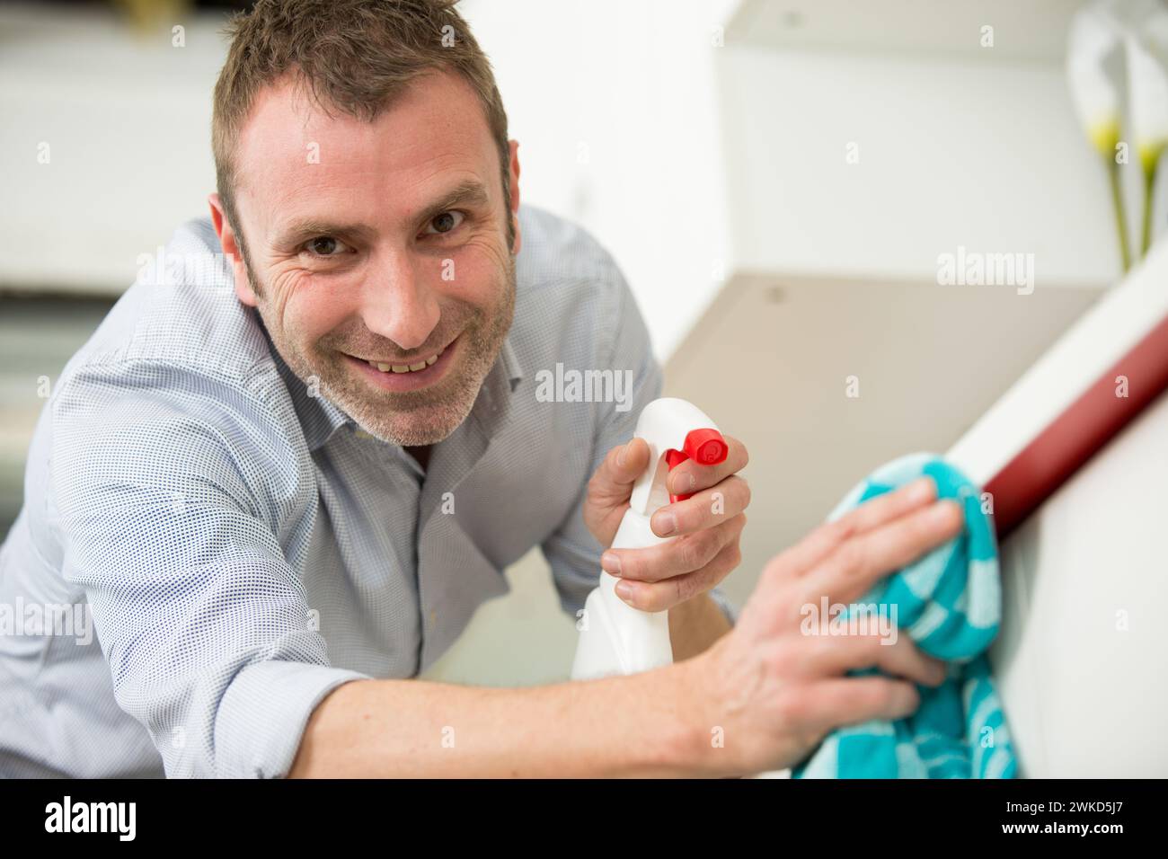 Man using a spray bottle hi-res stock photography and images - Alamy