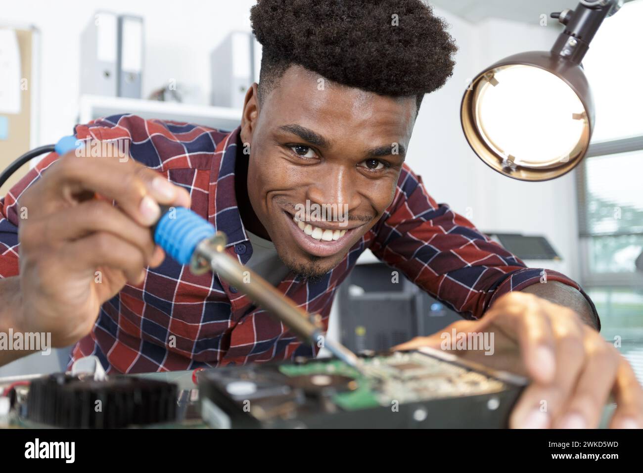 happy man repairing the computer laptop Stock Photo - Alamy