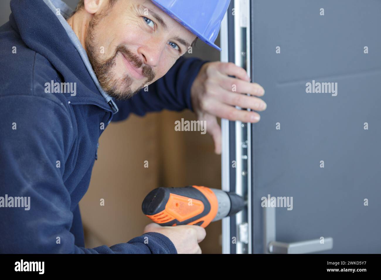 Man drills hole in metal hi-res stock photography and images - Alamy