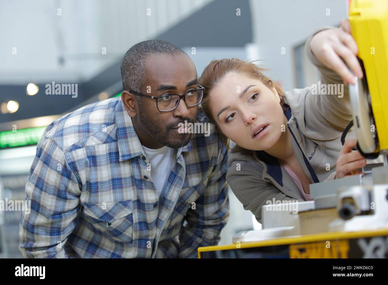 engineer showing apprentice how to use cnc tool making machine Stock ...