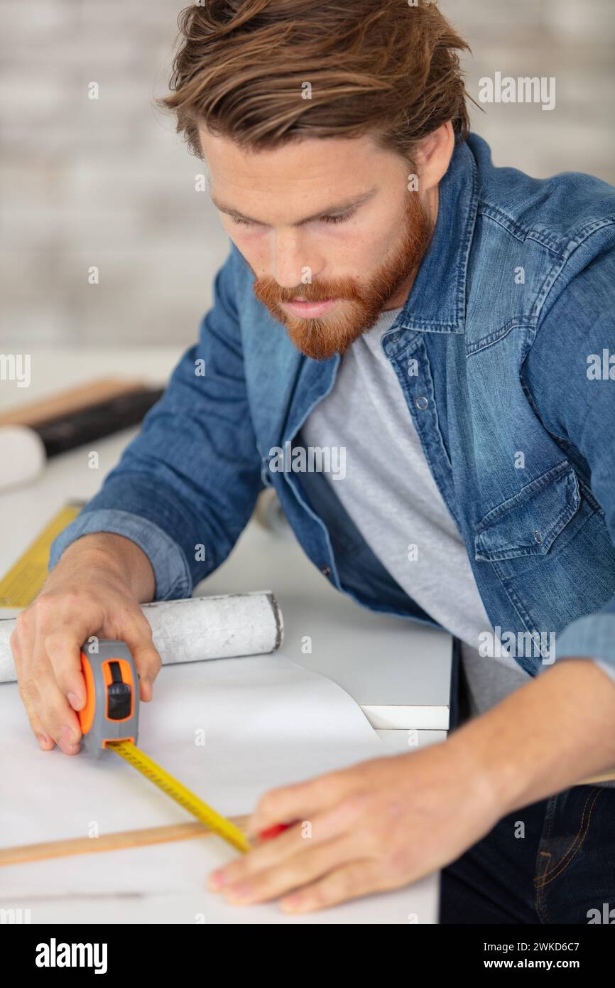 middle aged handsome carpenter making final touches Stock Photo - Alamy