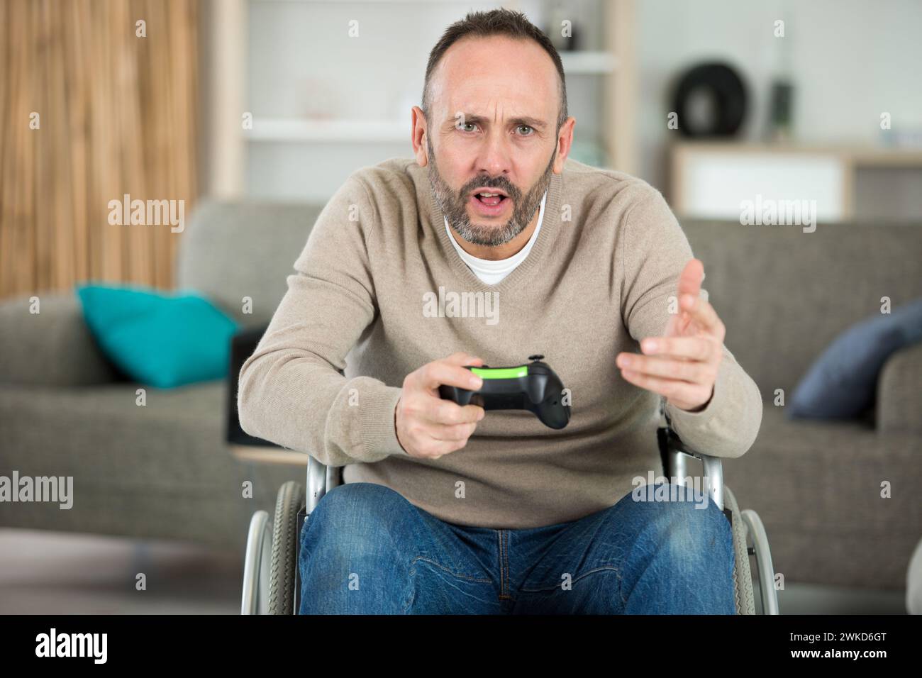 disabled man playing computer games during rehabilitation Stock Photo ...