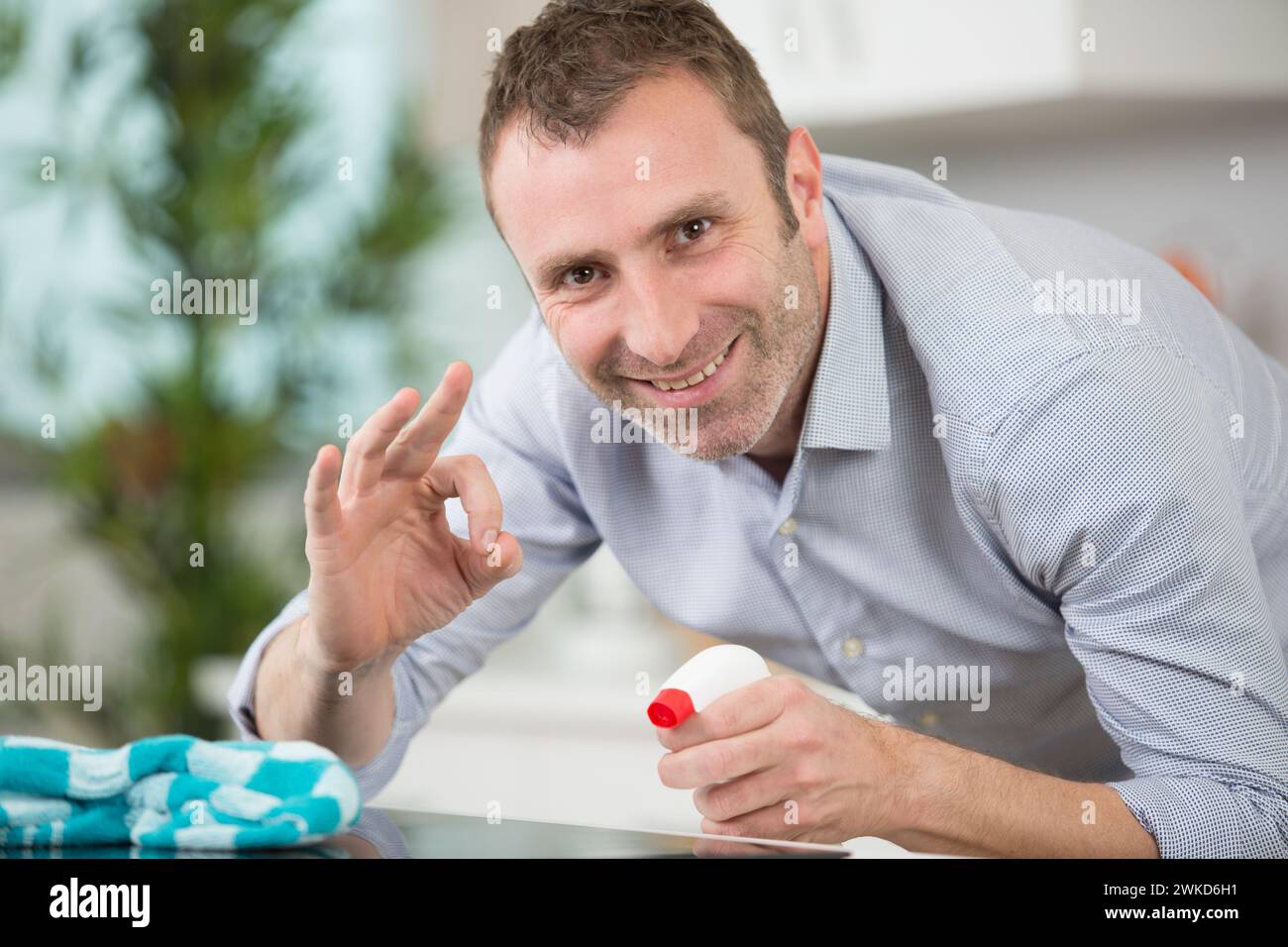 man shows thumbs symbol okay on red background Stock Photo - Alamy
