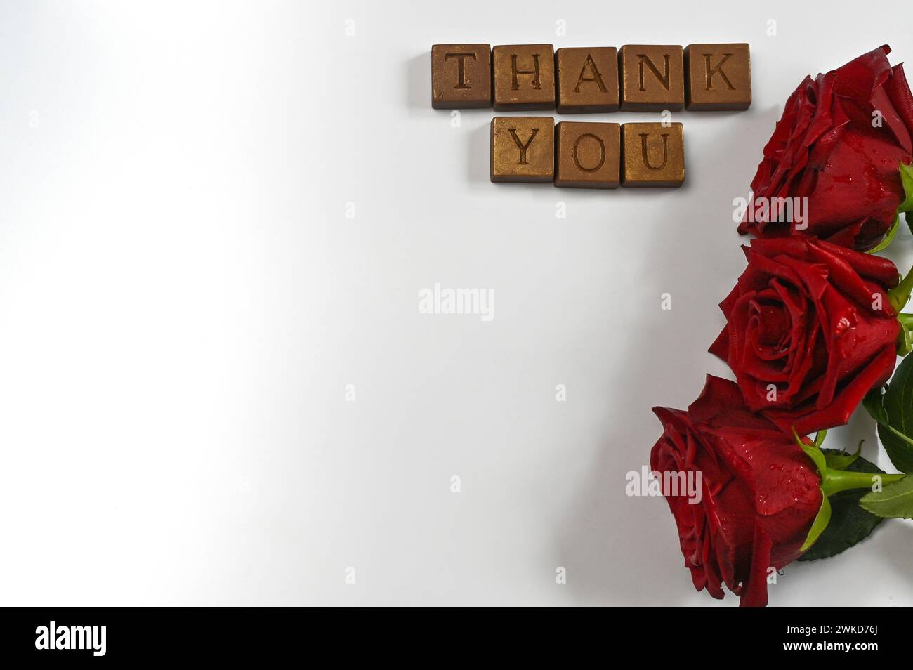 The concept is thank you. roses on a white background with sweets Stock ...