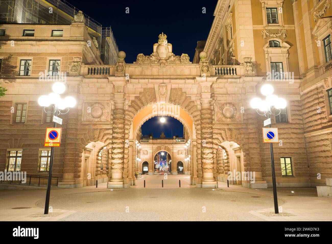 Night view of the gates of Swedish Parliament House at Riksgatan in ...