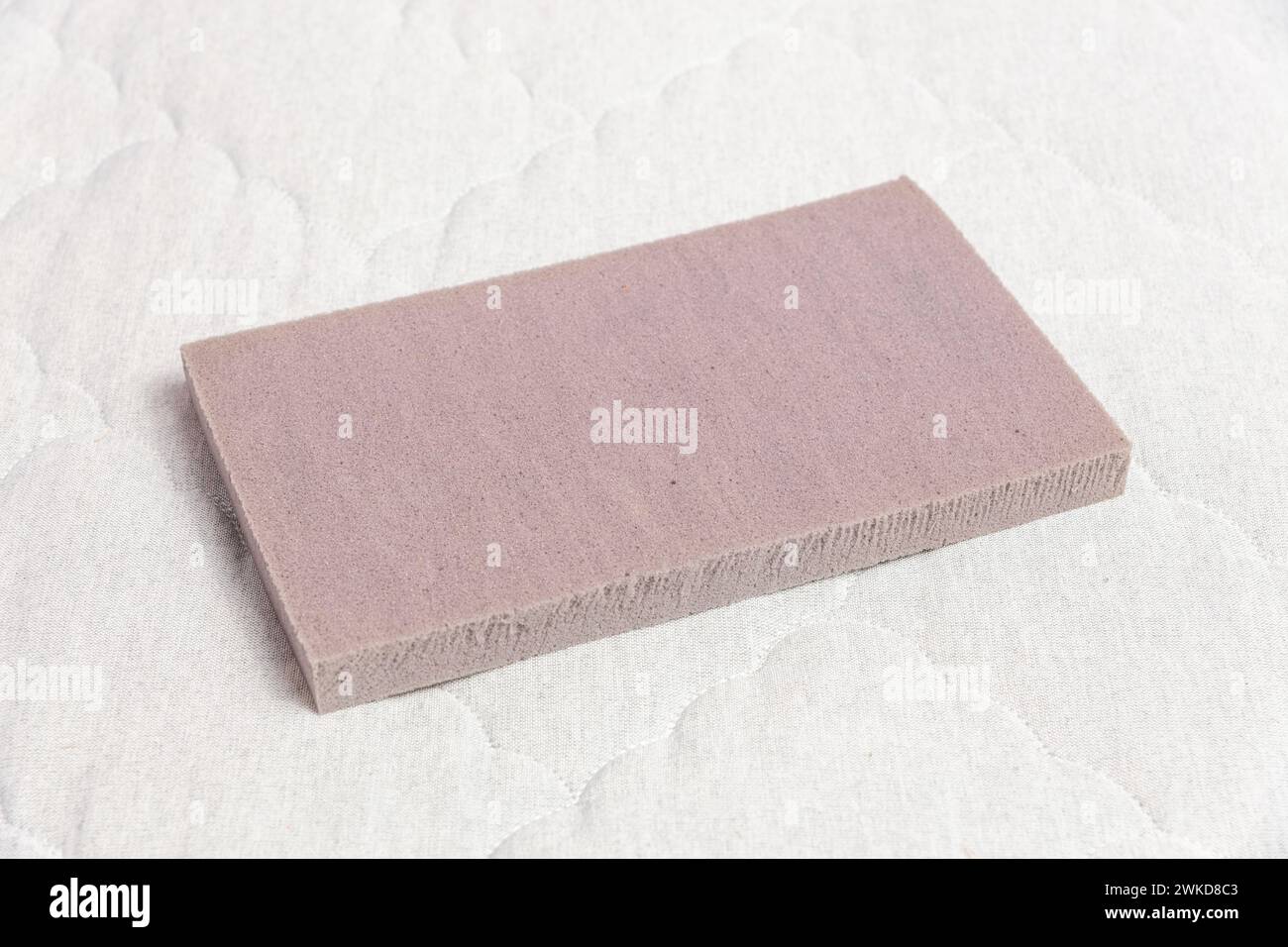 A rectangular sample of rubber foam used in the production of modern ...