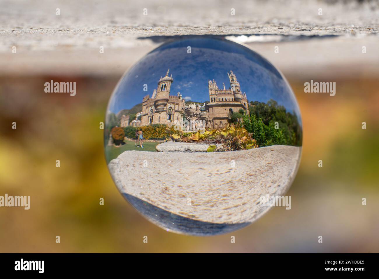 Glass sphere reflecting the castle of Colomares in different medieval ...