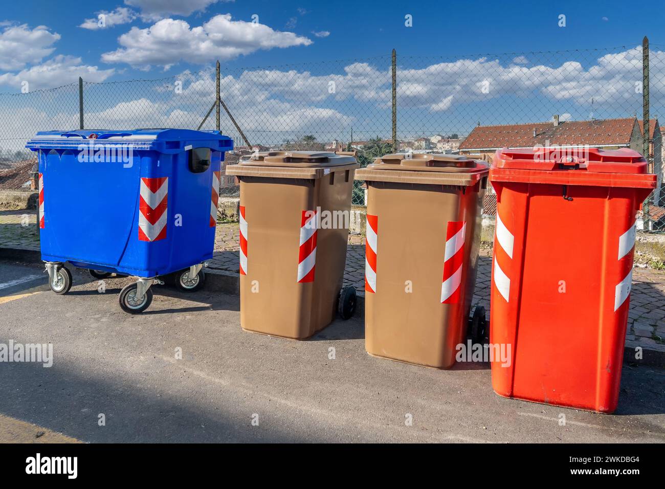 Bins for separate waste collection of various colors at Italian ...