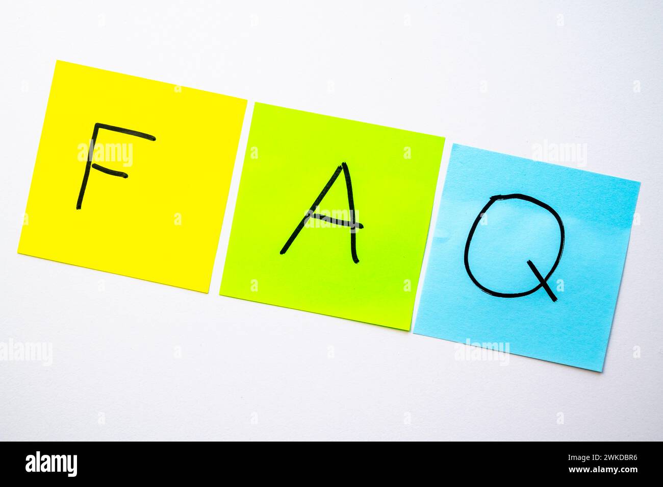 Colorful cards with FAQ, frequently asked questions written on them ...