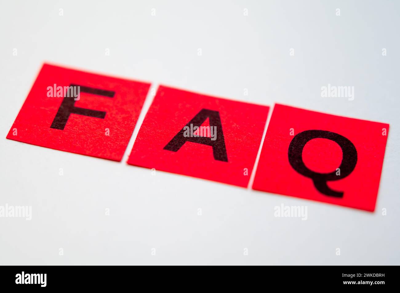 Colorful cards with FAQ, frequently asked questions written on them ...