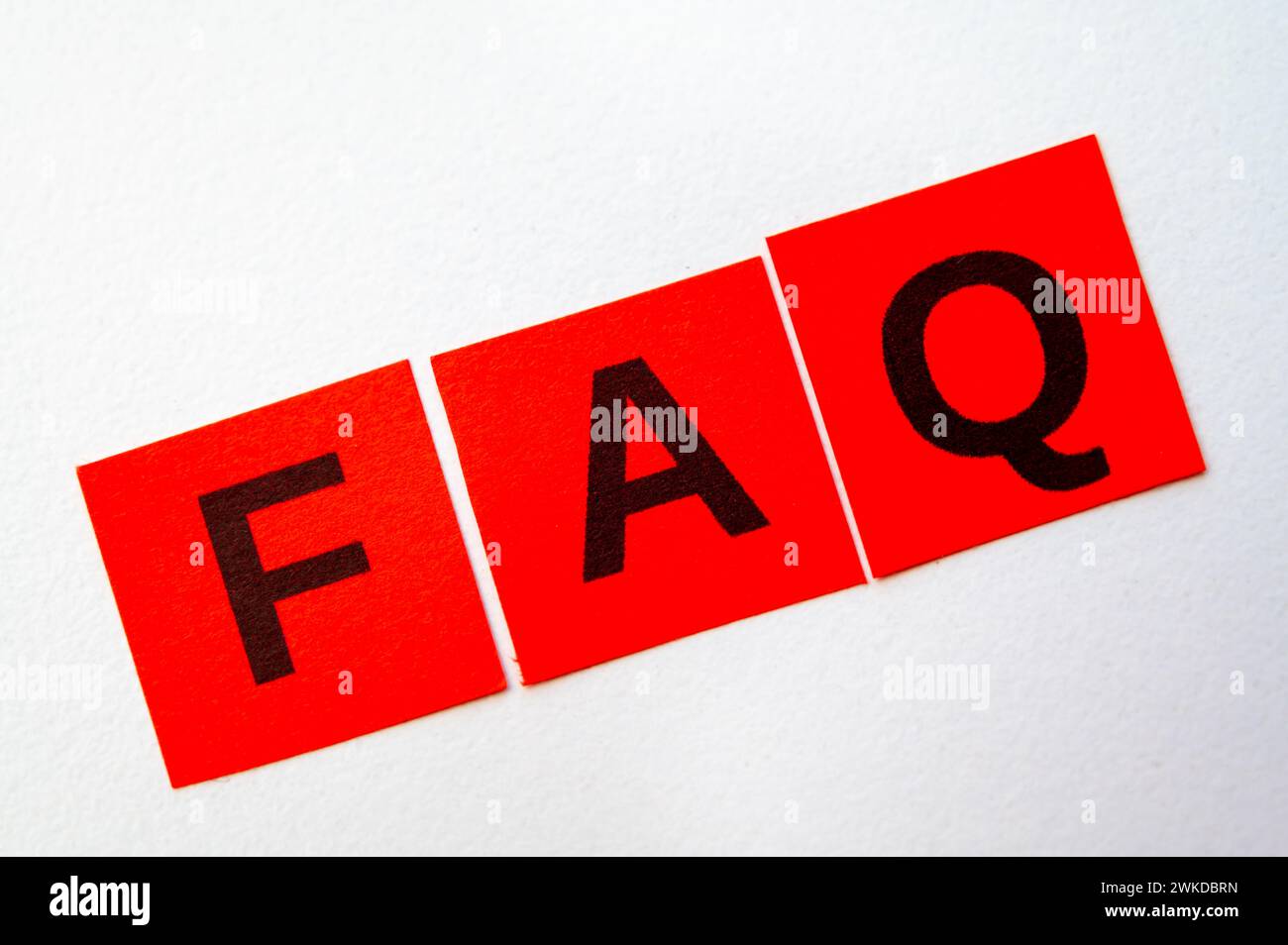 Colorful cards with FAQ, frequently asked questions written on them ...