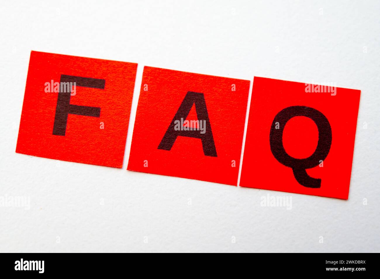 Colorful cards with FAQ, frequently asked questions written on them ...