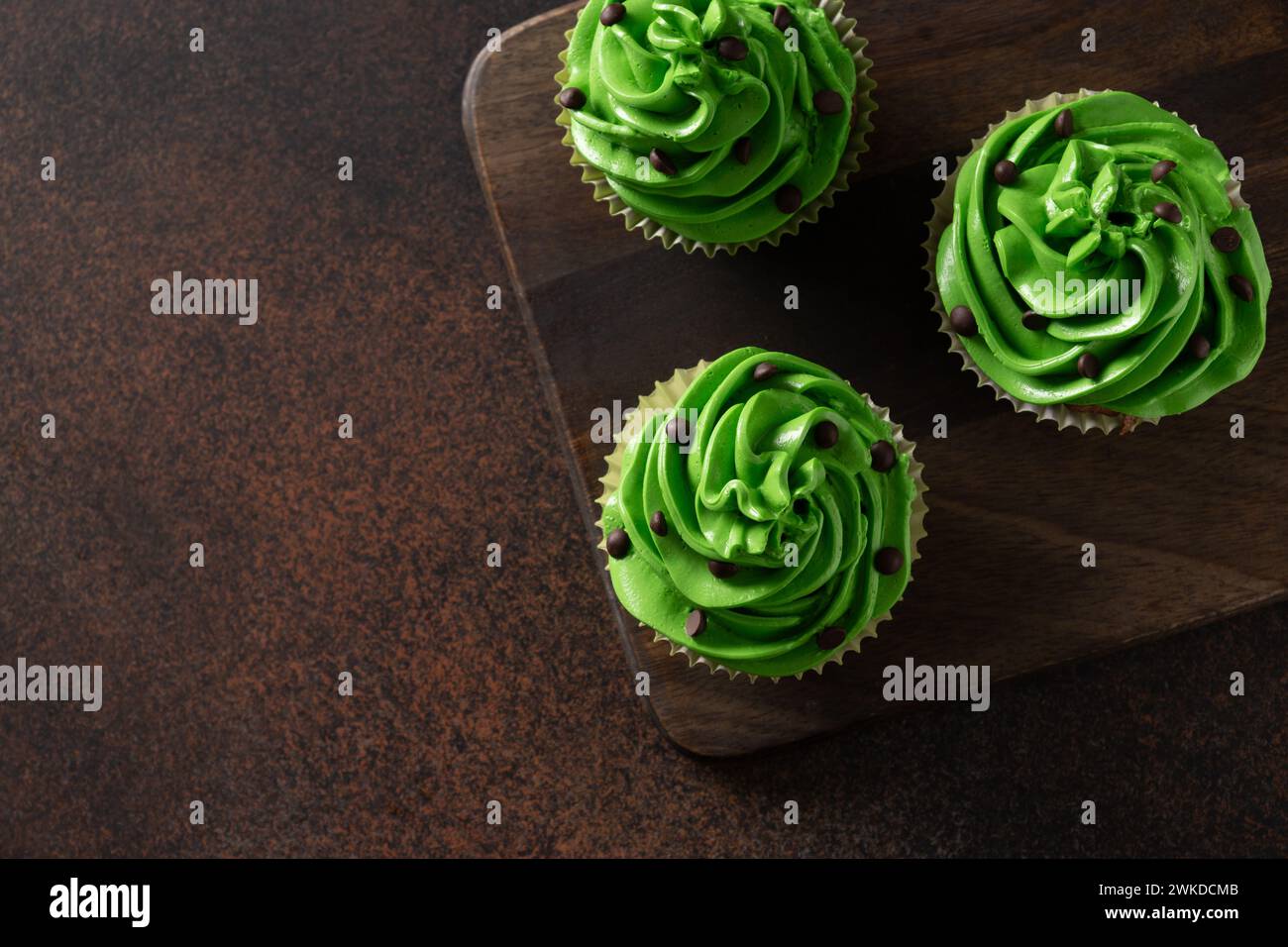 St. Patrick's Day chocolate cupcakes with green whipped cream decorated ...