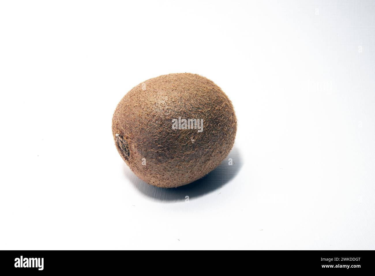 Whole kiwi fruit close-up isolated on white background Stock Photo - Alamy
