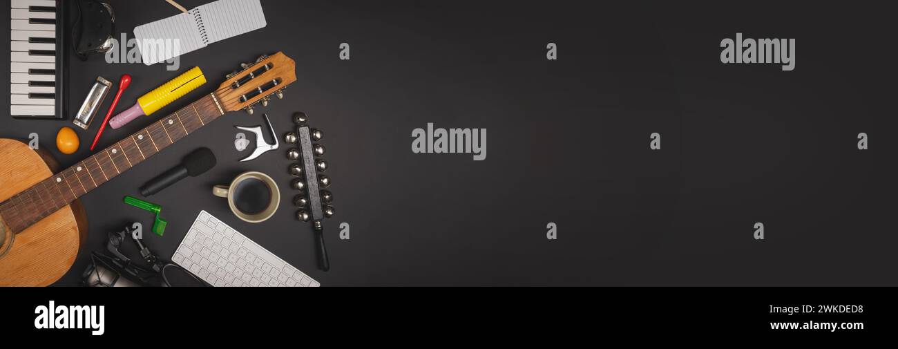 Assorted musical instruments and recording gadgets on a dark background ...