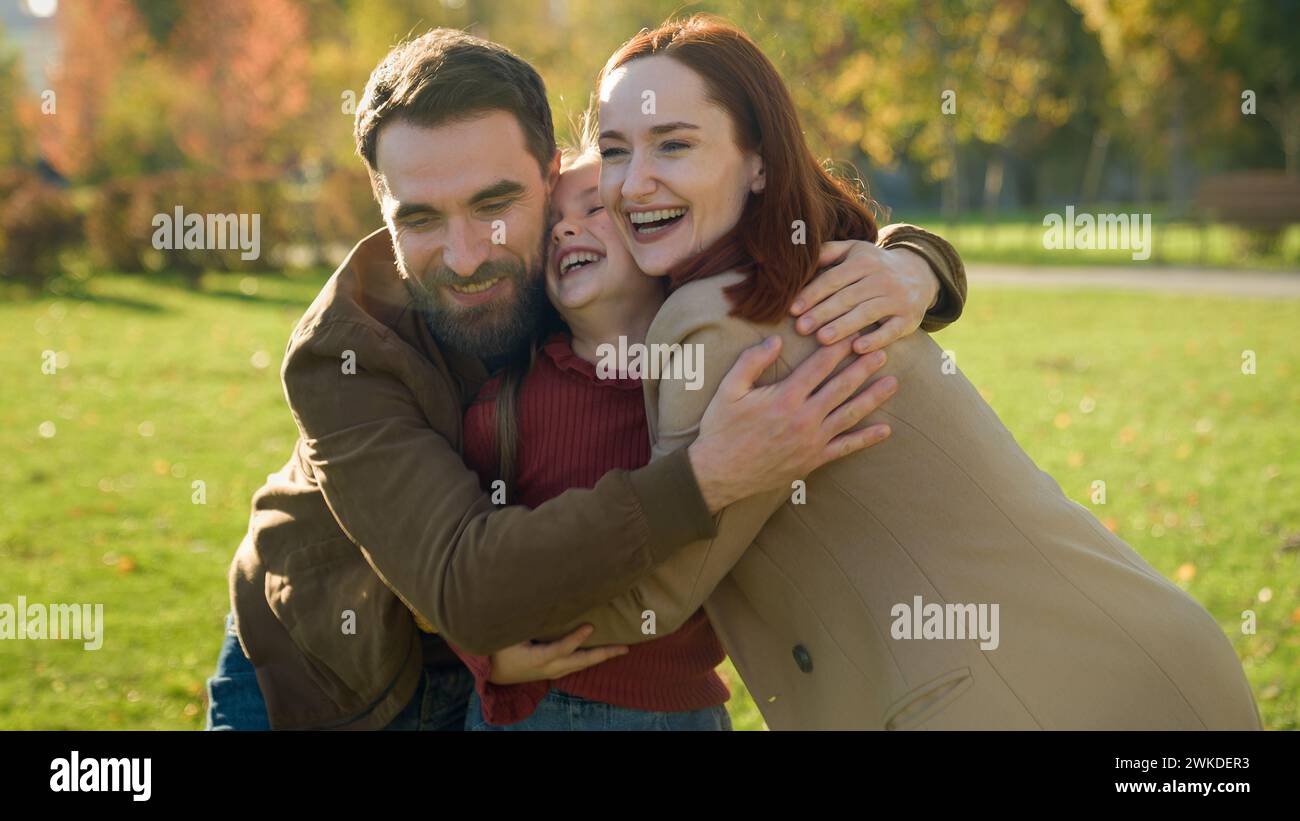 Happy Caucasian family laughing hugging together holiday weekend at ...