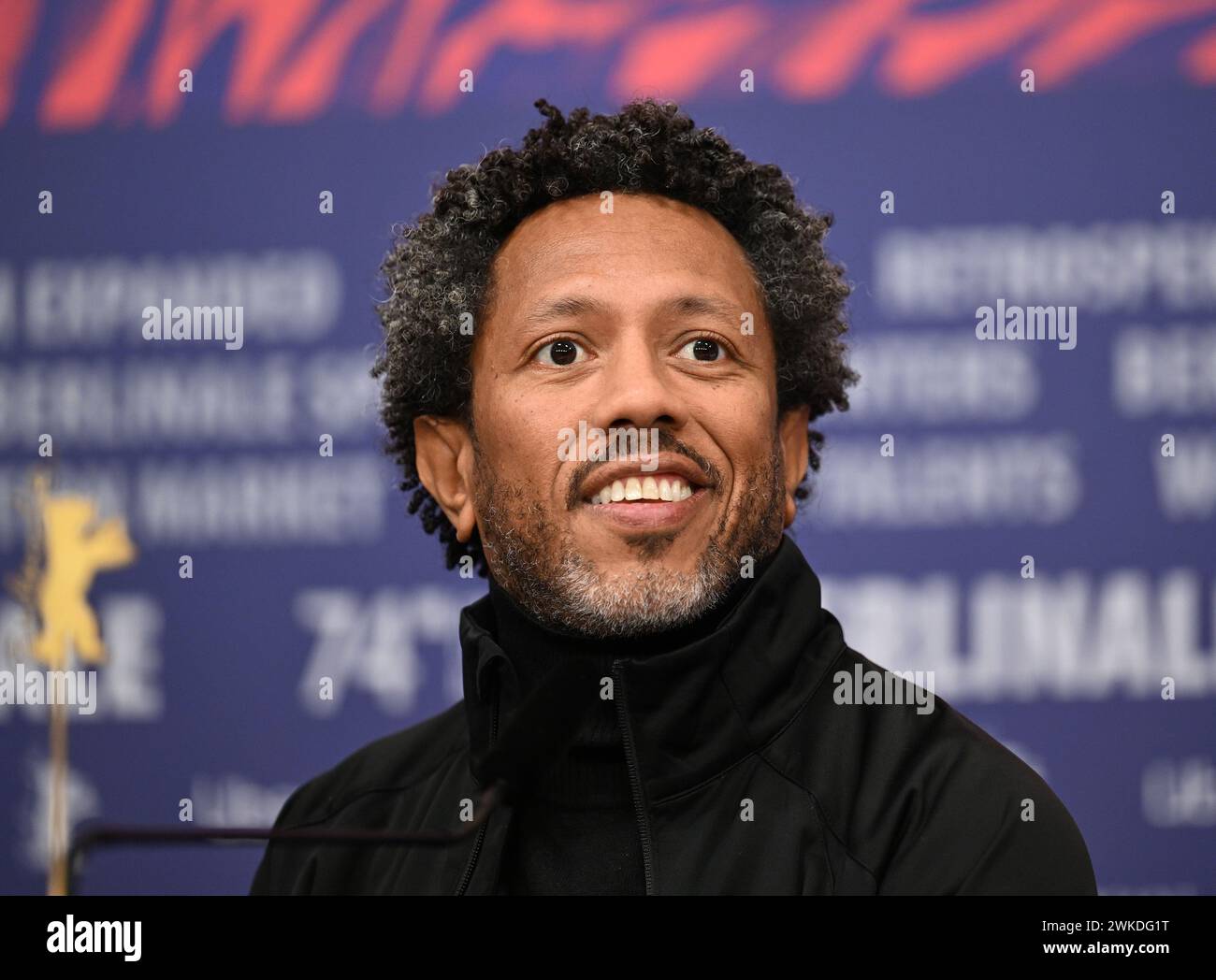 Berlin, Germany. 20th Feb, 2024. Jhon Narváez (speaker) laughs during ...
