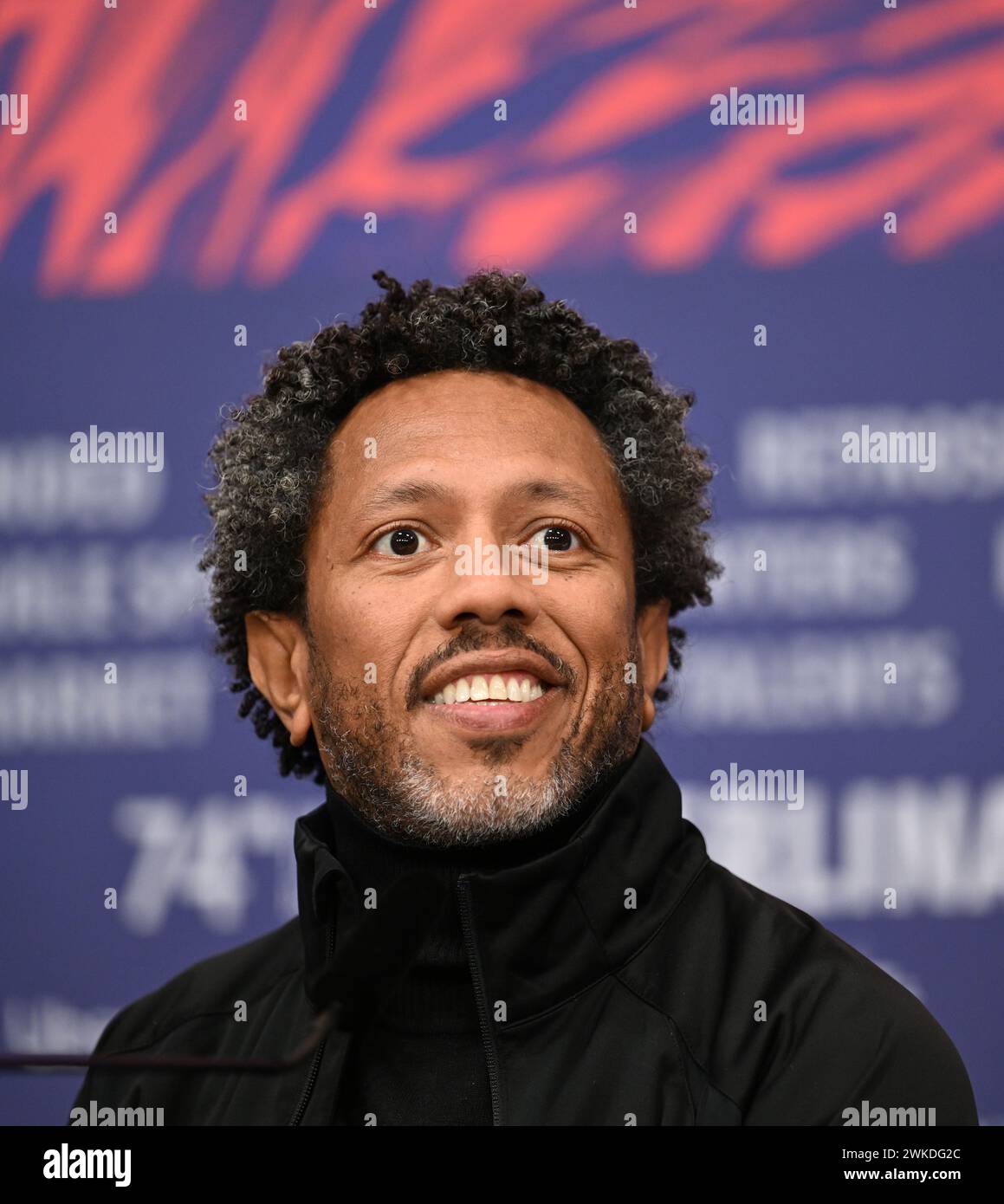 Berlin, Germany. 20th Feb, 2024. Jhon Narváez (speaker) laughs during ...