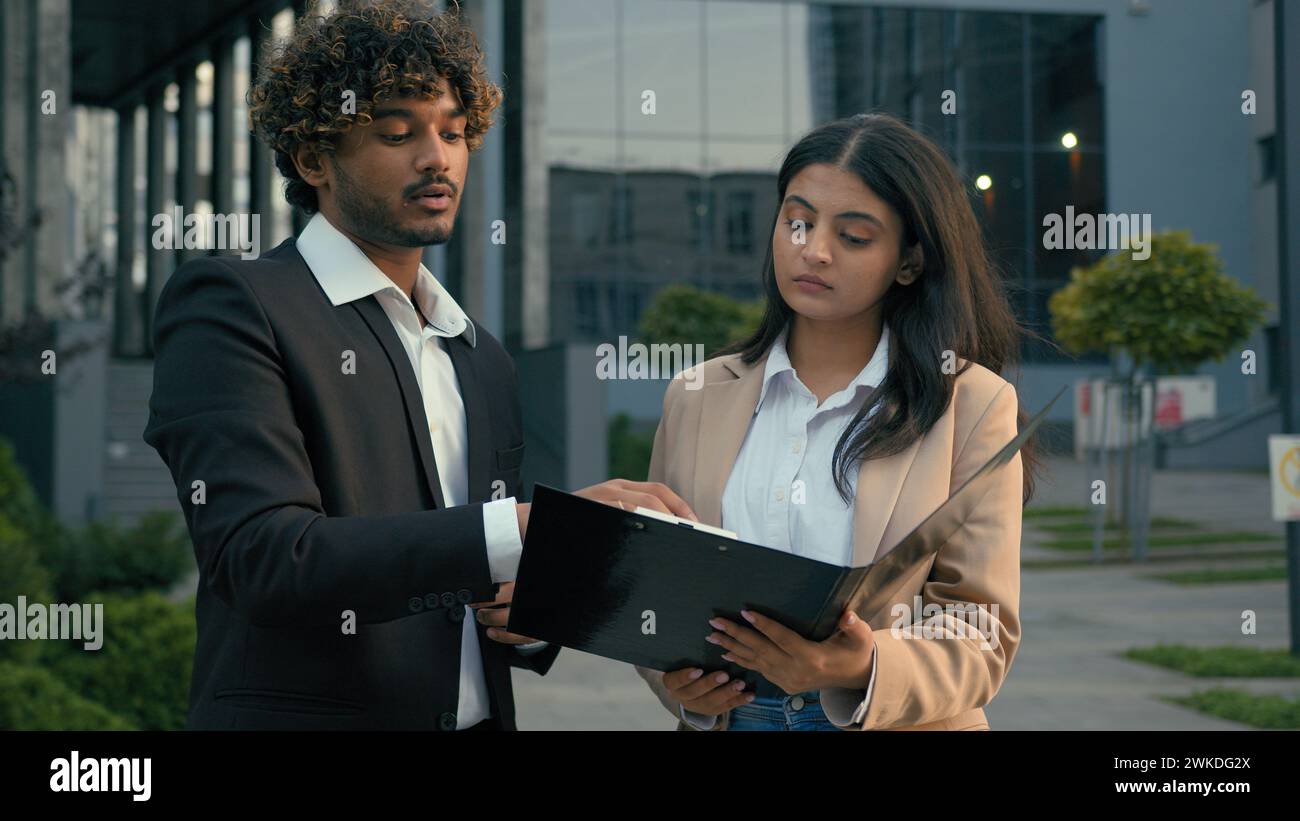 Indian male man businessman ceo boss leader consulting Arabian woman ...