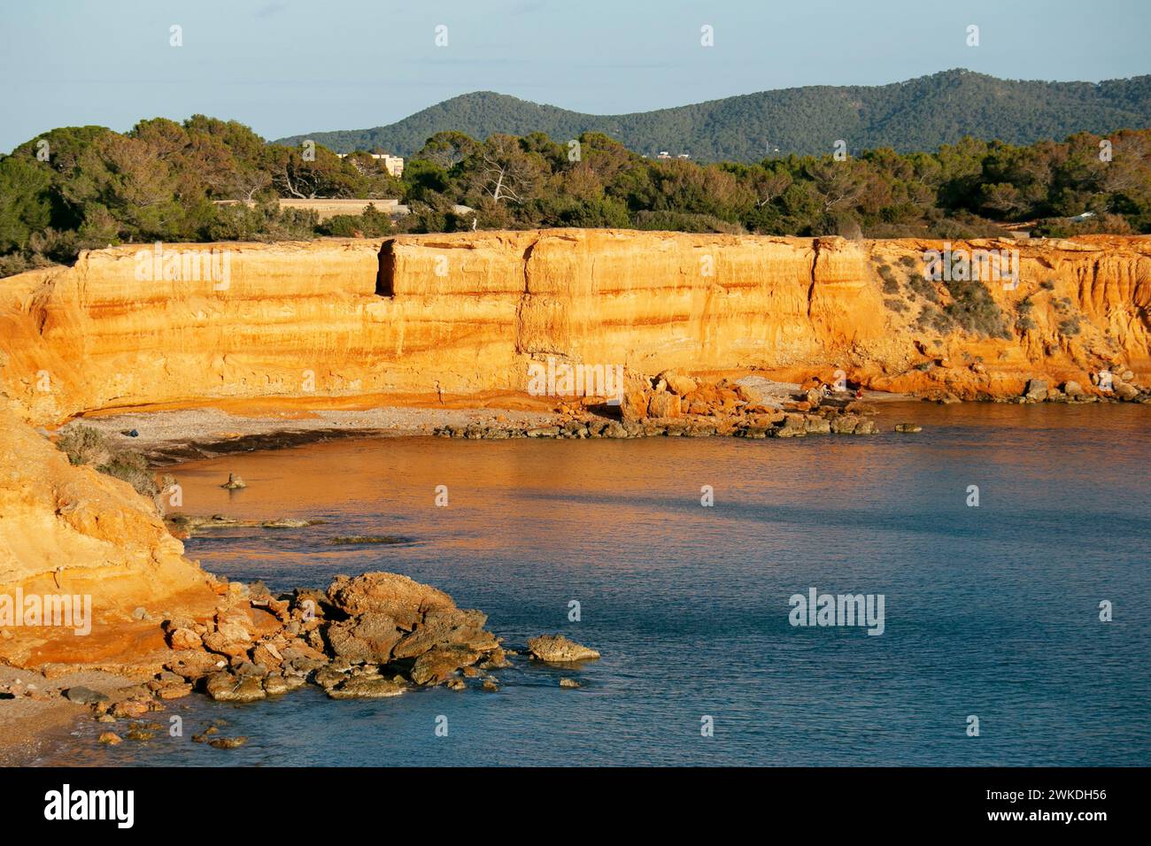 Sa Caleta beach in Ibiza. Beautiful beach with reddish rock and crystal ...