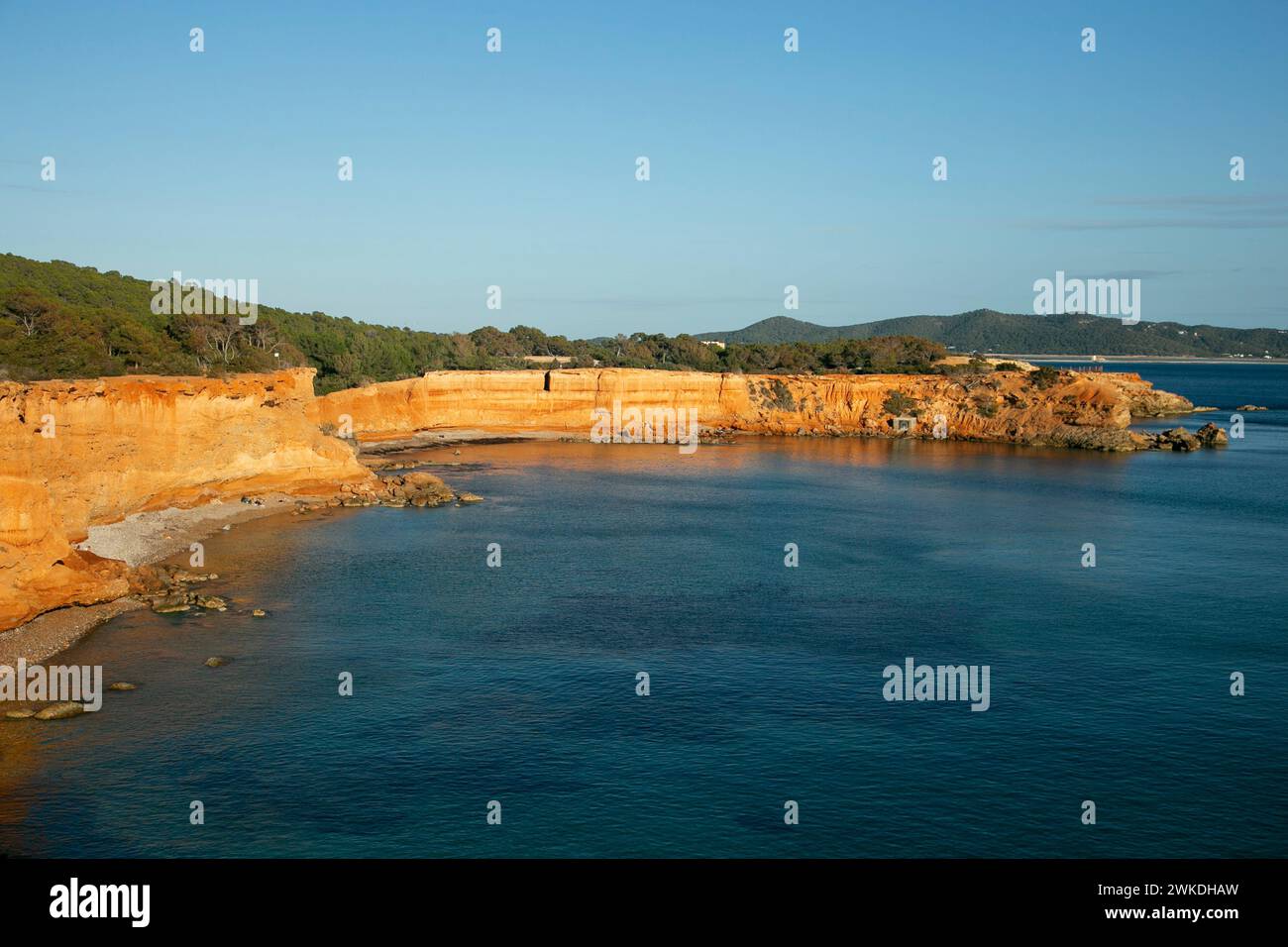 Sa Caleta beach in Ibiza. Beautiful beach with reddish rock and crystal ...