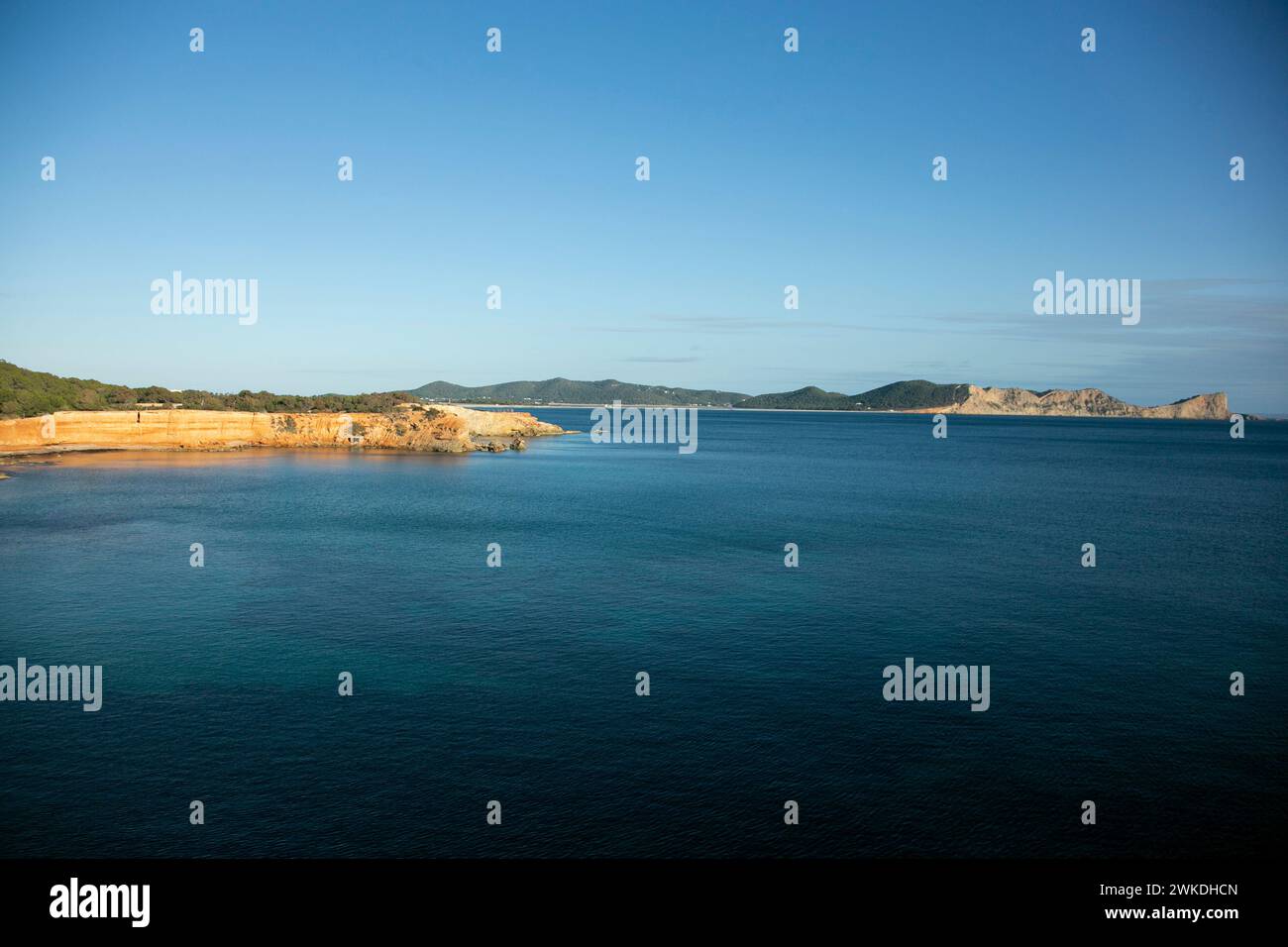 Sa Caleta beach in Ibiza. Beautiful beach with reddish rock and crystal ...