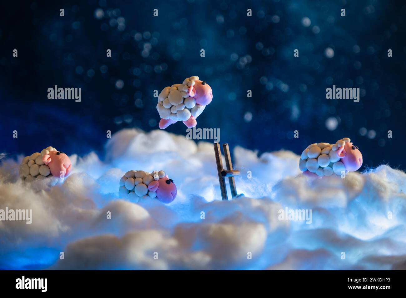 Cute plasticine sheep jumping over a fence in the clouds. Count sheep ...