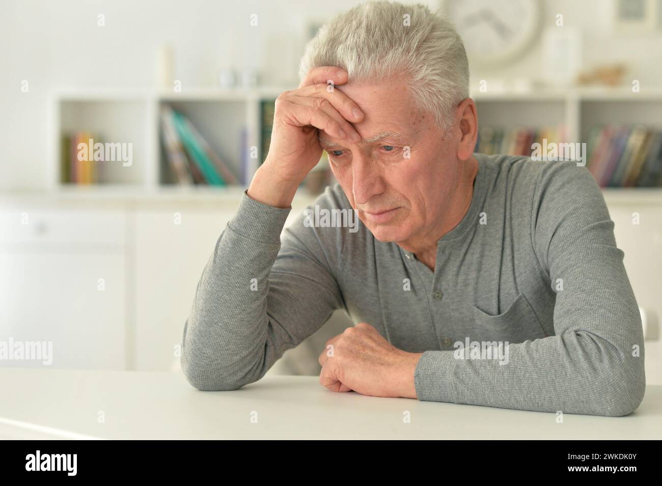Portrait of sad senior man at home Stock Photo - Alamy