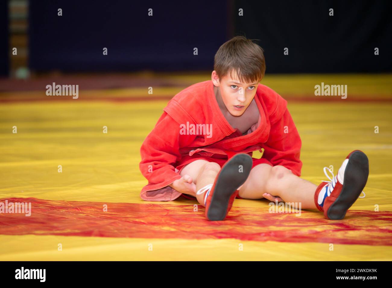 October 28, 2022. Open sambo training. A boy sambist warms up on the ...