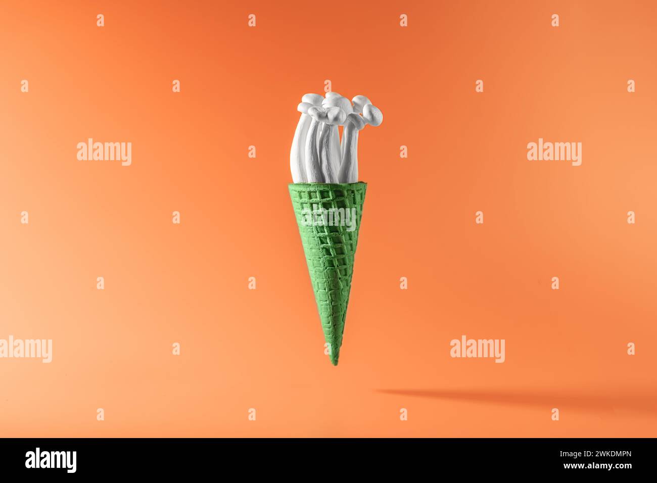 Closeup of a bunch of shimeji mushrooms in green ice cream cone, on ...