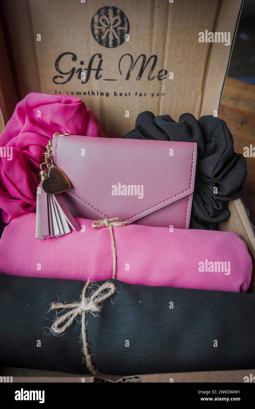 Stock photo of gift box wrapped in craft paper with gold ribbon with ...