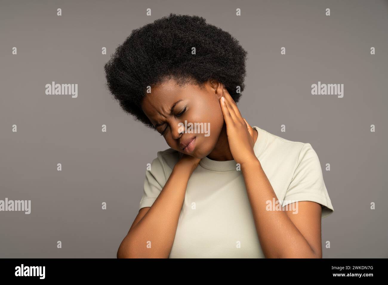 Unhealthy black female touching painful neck, suffering from pinched ...